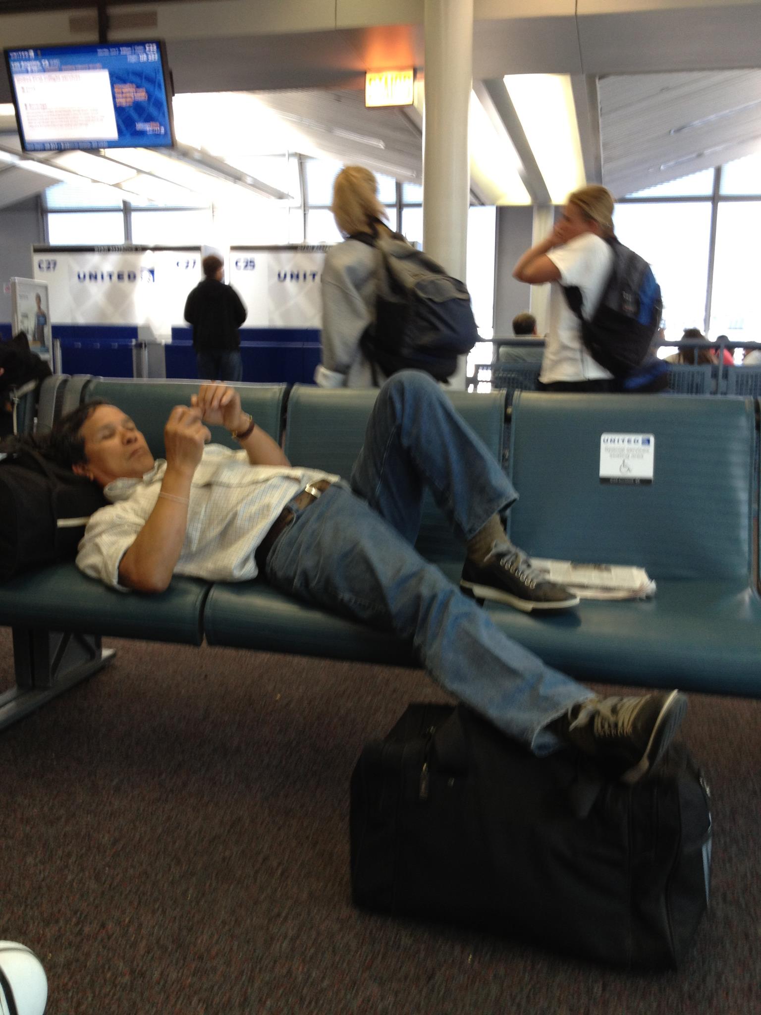 Laying across 3 seats, clipping his nails, and dog shit shoe on 3rd ...